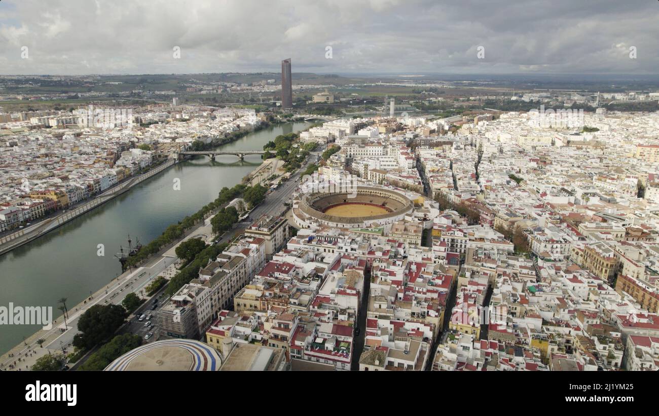 A beautiful aerial view of the arena among other buildings in Seville ...