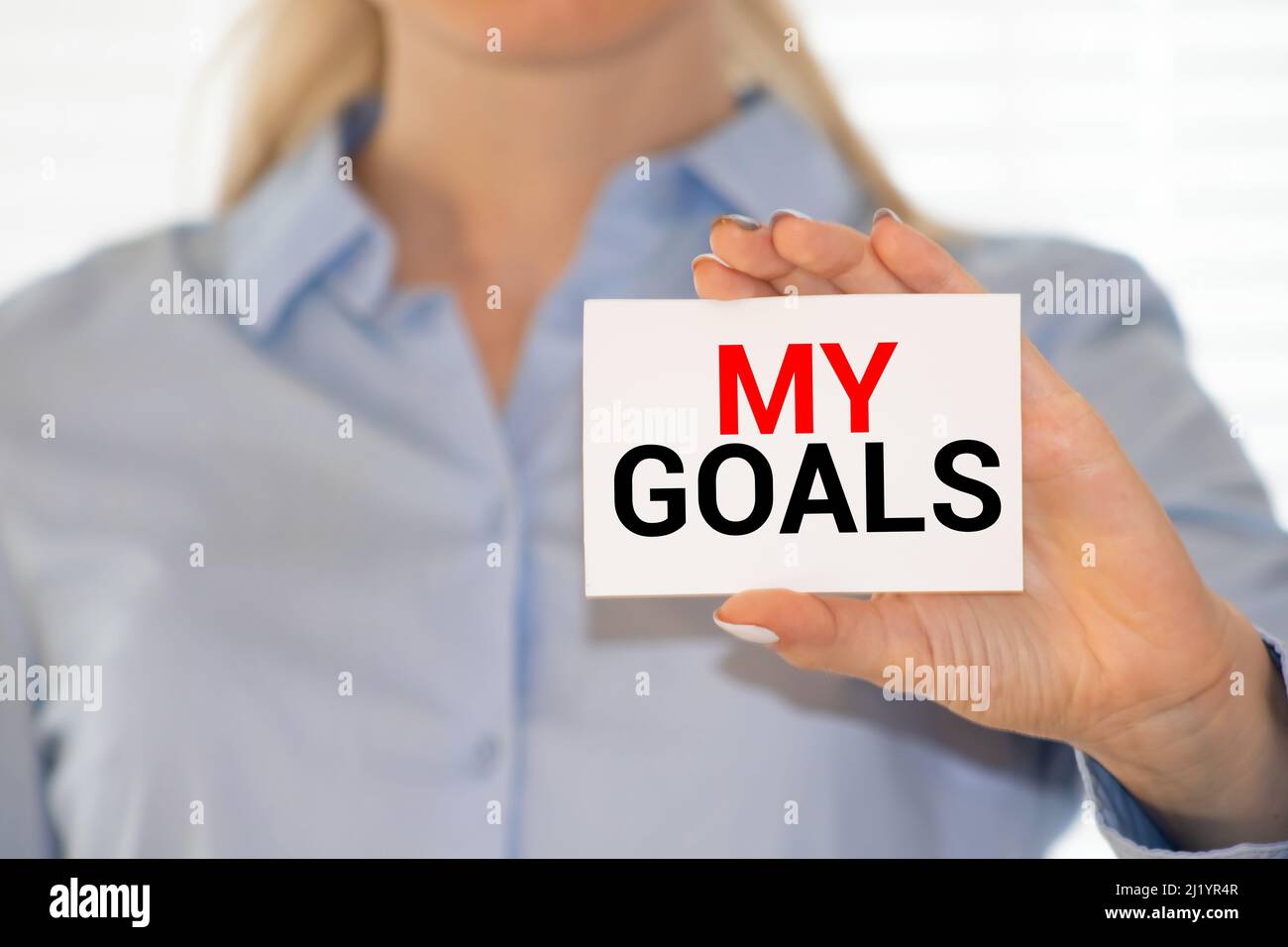my goals lettering on yellow paper that wishes on a notebook on the ...