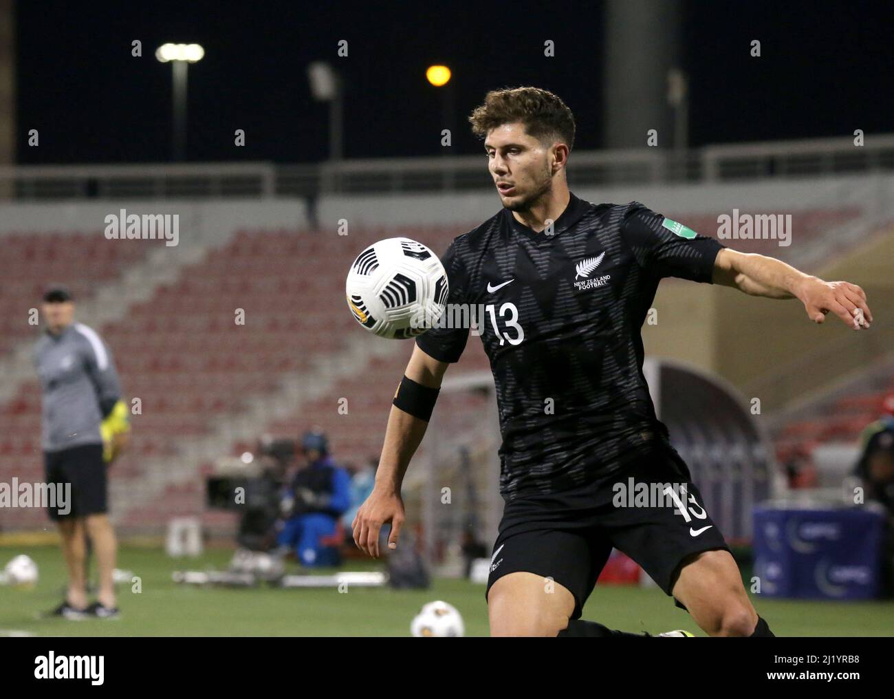 DOHA, QATAR - MARCH 27: Liberato Cacace of New Zealand in action ...
