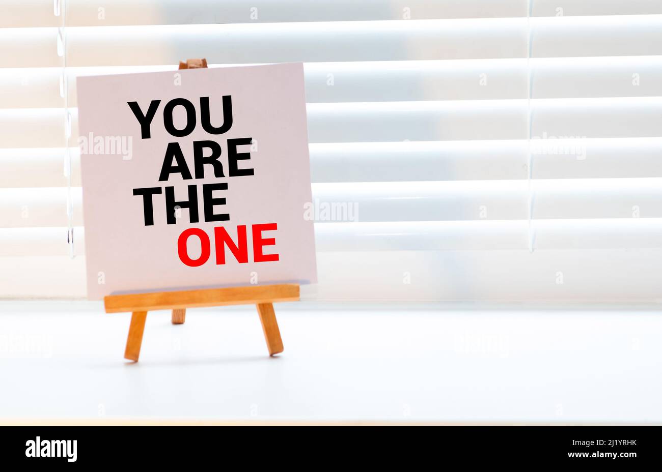 You are the one word written under torn paper Stock Photo - Alamy
