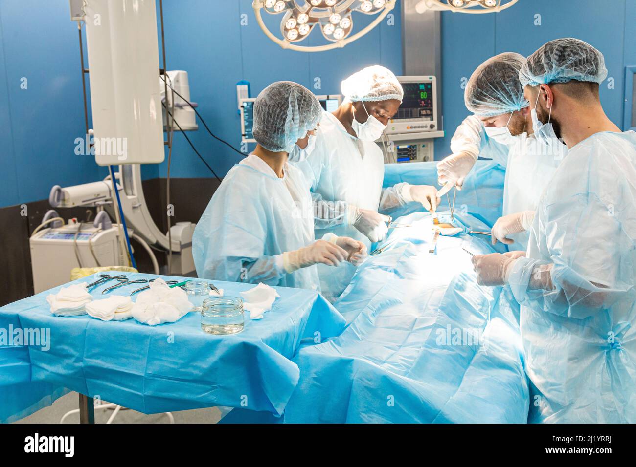 The senior surgeon in the operating room, where the patient is waiting ...