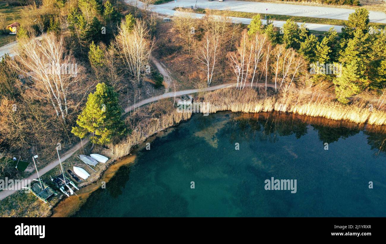 An aerial view of a lake surrounded by trees in Steinberg am See ...