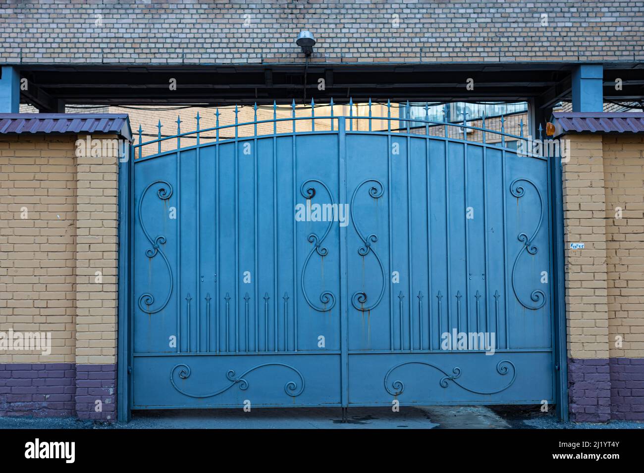 closed large metal gates of blue color. High quality photo Stock Photo ...