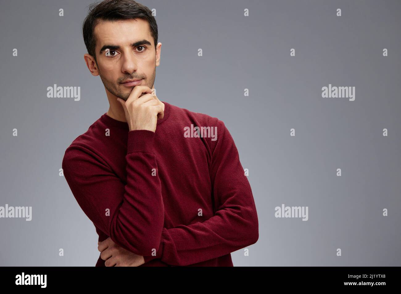 successful man in a red sweater hand gesture posing self confidence ...