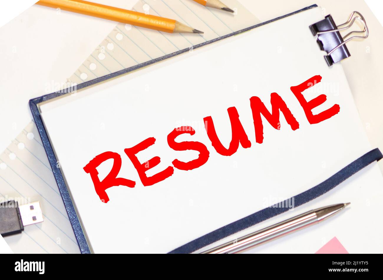 RESUME written on a white page with office tools Stock Photo - Alamy