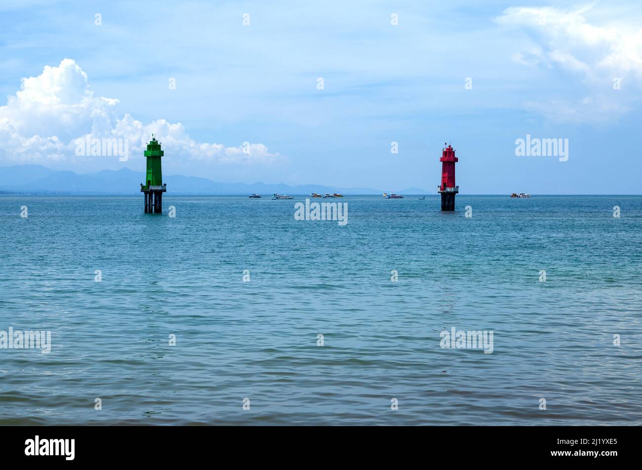 Red and red lighthouses at Sanur Port in Bali, Indonesia with ferry ...