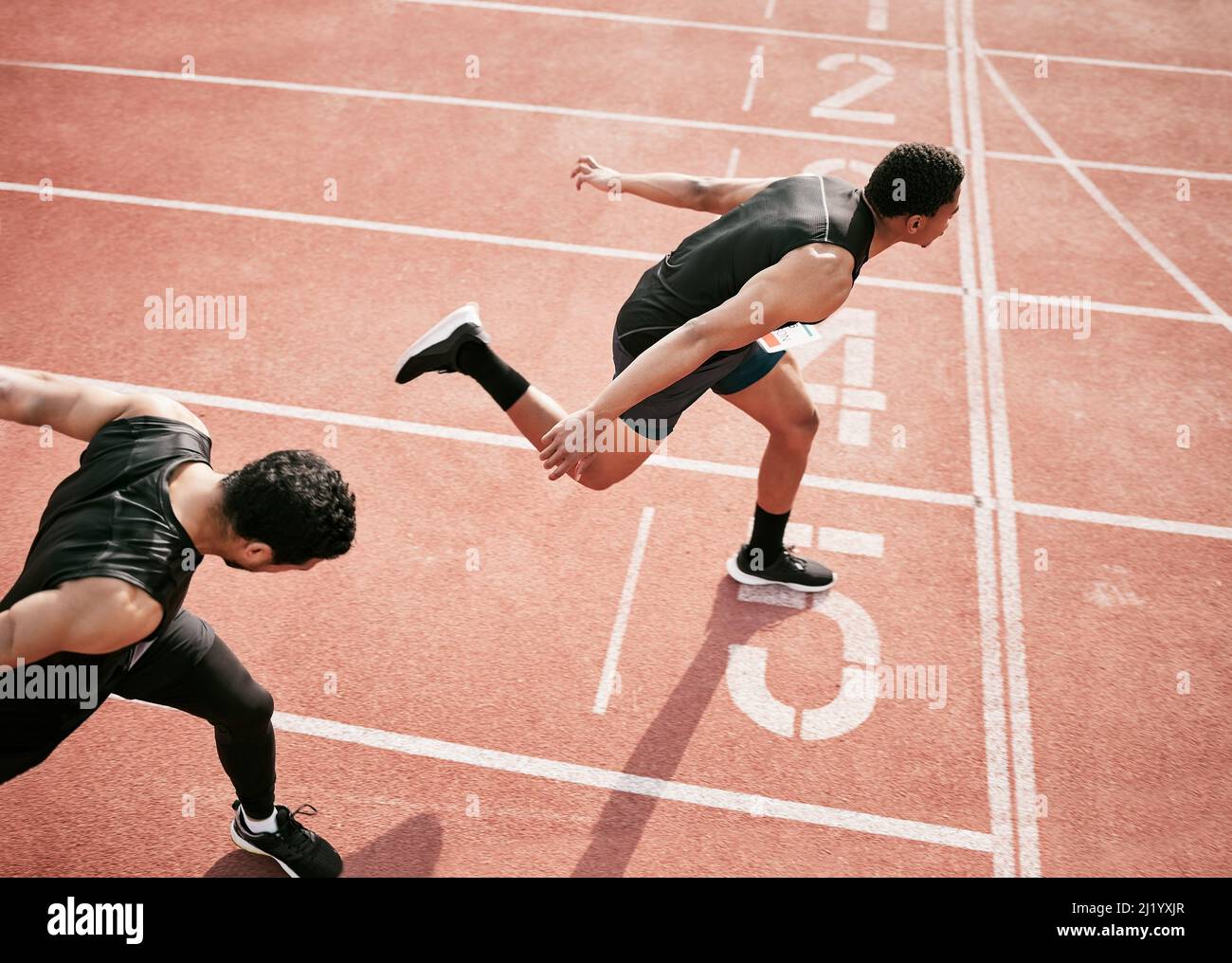 Hes stolen it. High angle shot of two handsome young male athletes ...
