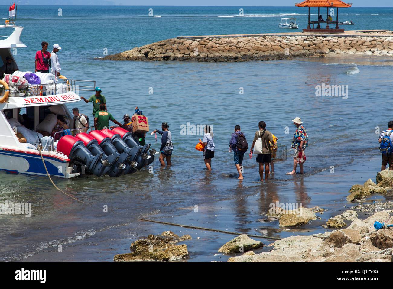 A fast boat with five large outboard engines at Sanur Port waiting to ...