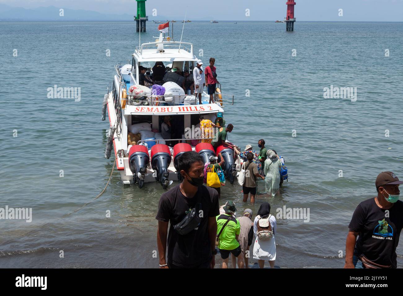 A fast boat with five large outboard engines at Sanur Port waiting to ...