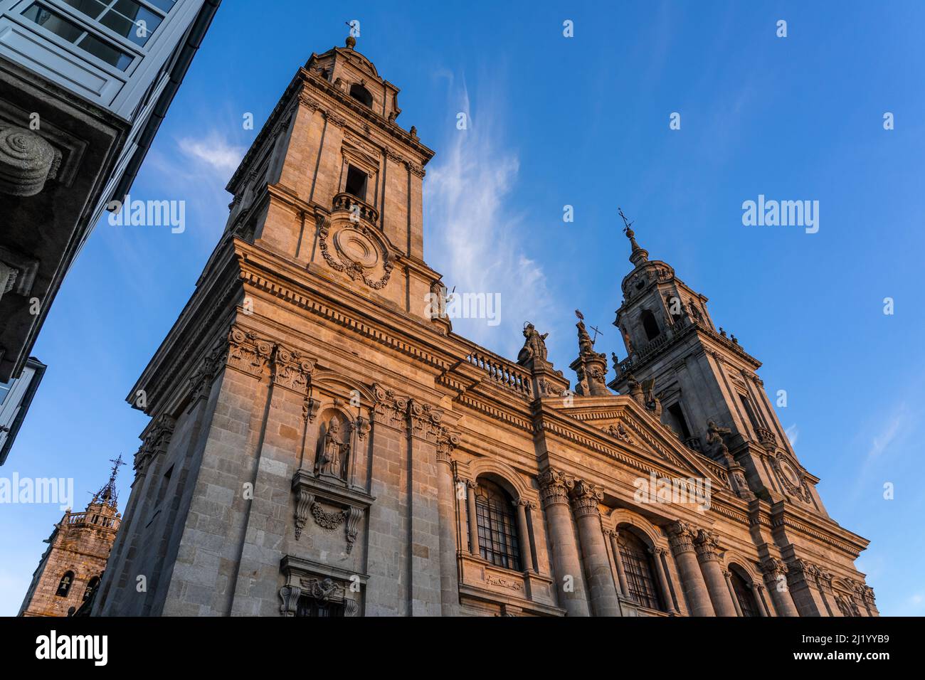 Cathedral of the fortified city of Lugo at sunset in a sunny day ...