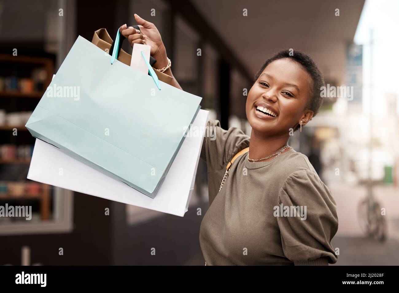 Who says happiness cant be bought. Portrait of an attractive young ...