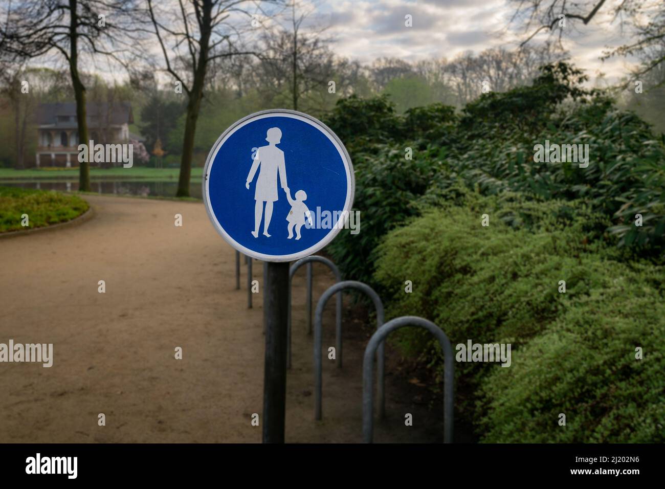 An outdoor view of a blue mother-child sign in a park Stock Photo - Alamy