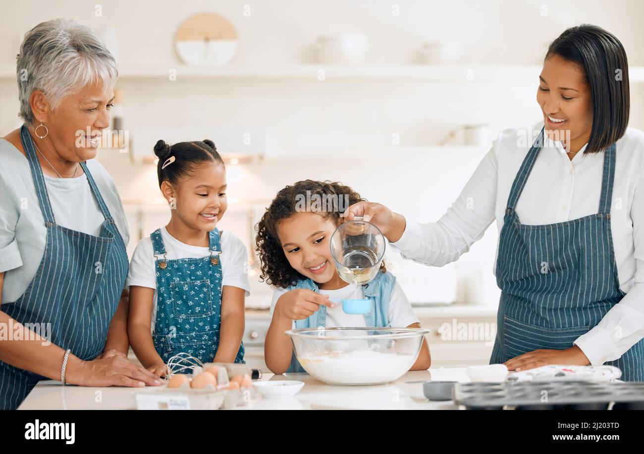 Everyone gets a turn to add their magic. Shot of a multi-generational ...
