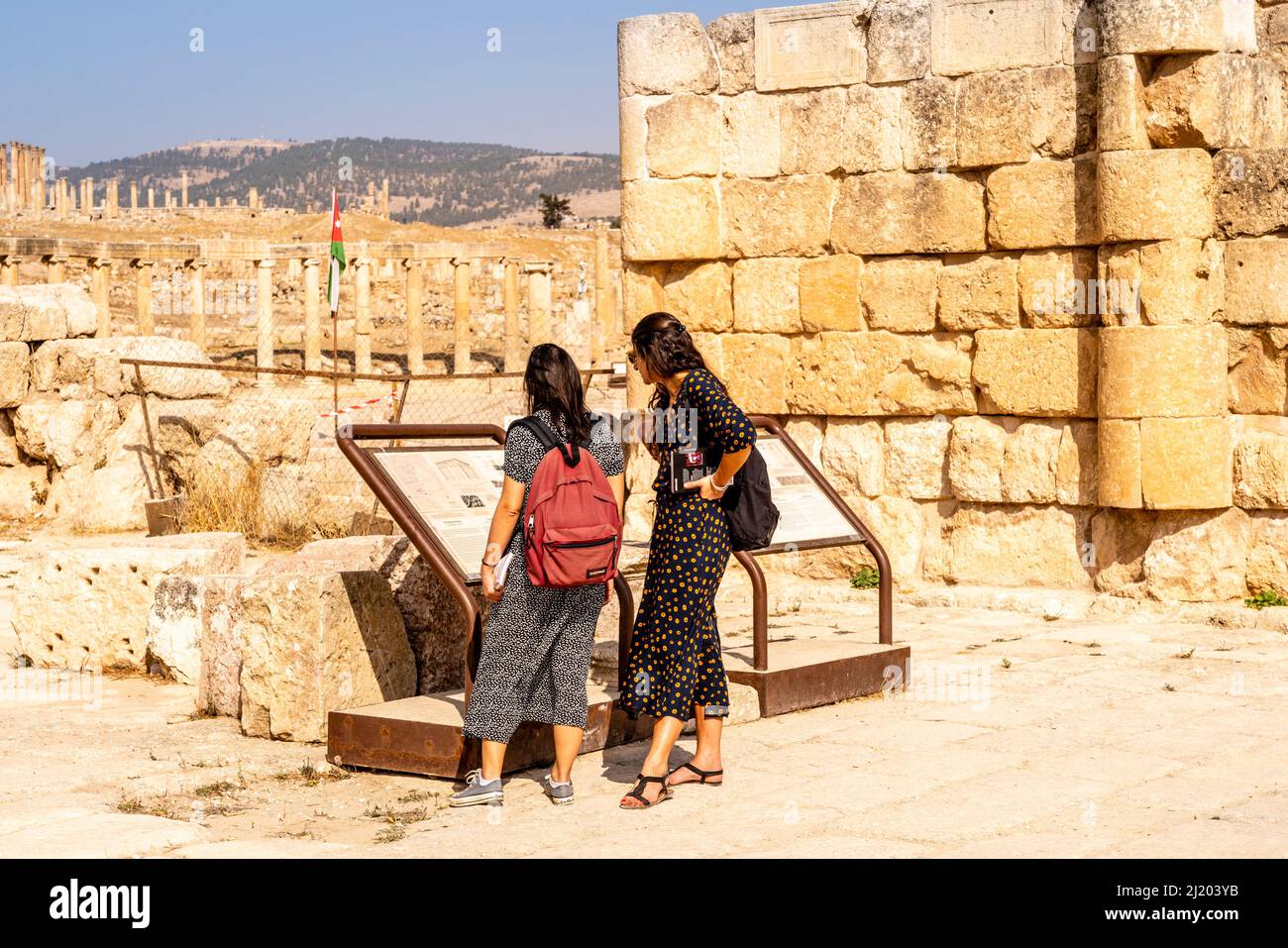 Two Female Visitors Look At A Map & Descriptions Of The Roman Ruins Of ...