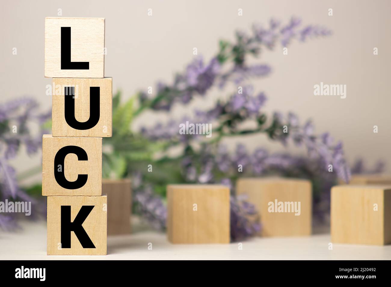 Letter block in word luck on wood background Stock Photo - Alamy