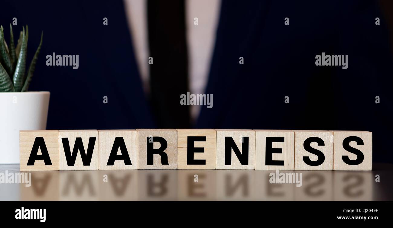 awareness word written on wood block. awareness text on table, concept ...
