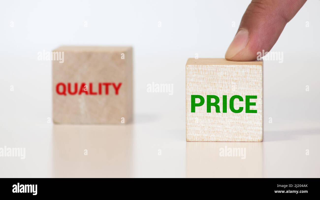 Price versus Quality. The cube with the word quality is selected by a ...