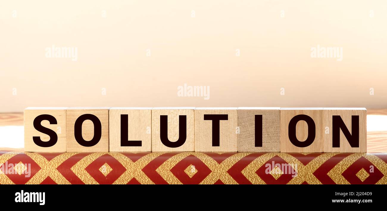 Solution word written on wood block. concept Stock Photo - Alamy