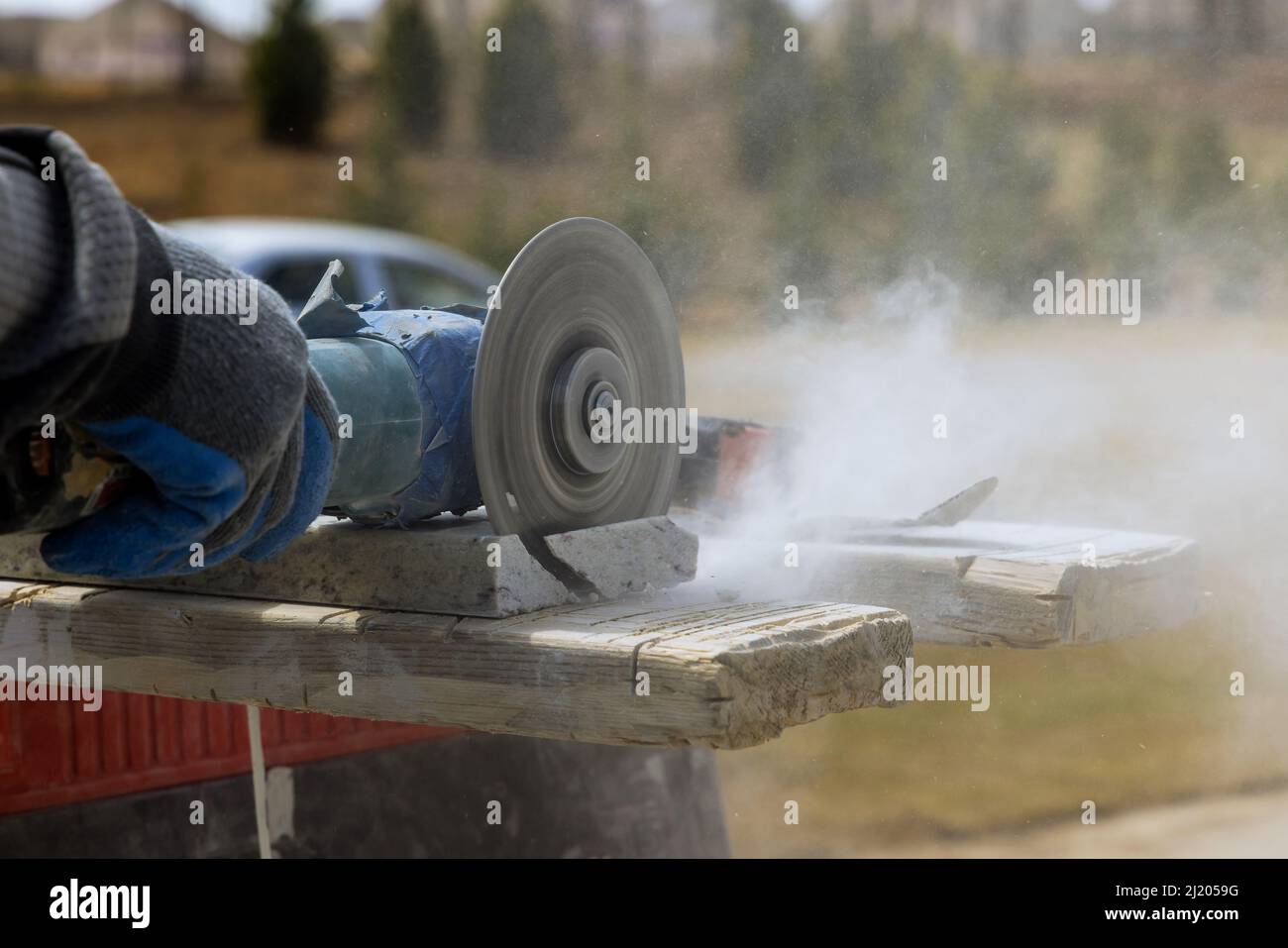 Dust from cutting marble stone with an electric grinder - diamond blade ...