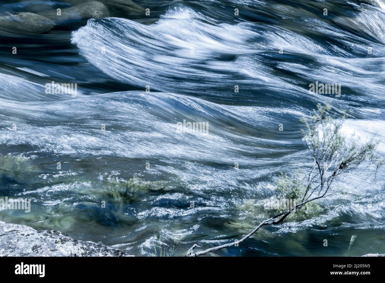 Rushing water creating waves with surface texture, Wairoa River ...