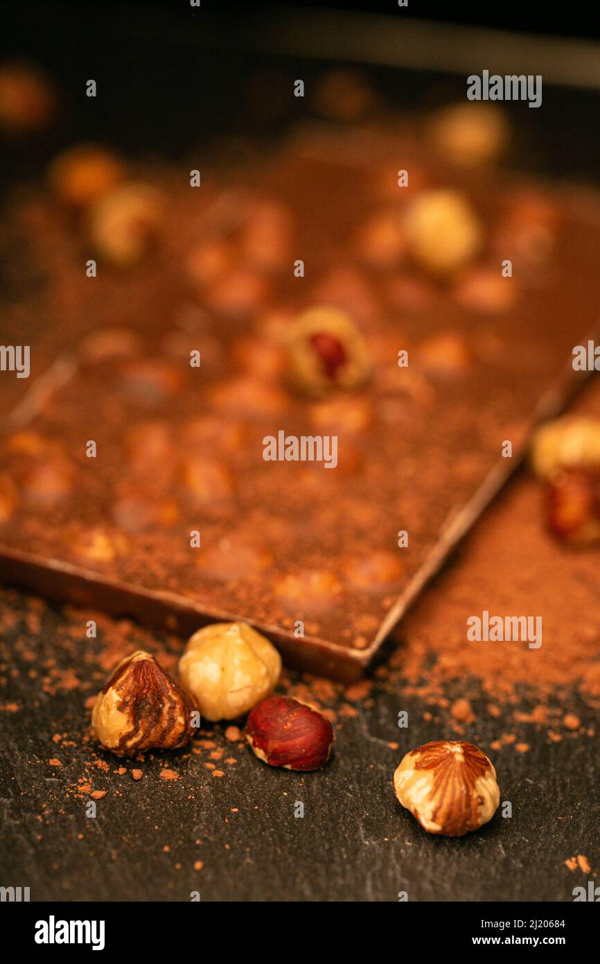 Chocolate with hazelnuts and cocoa powder.Desserts and sweets.Milk ...