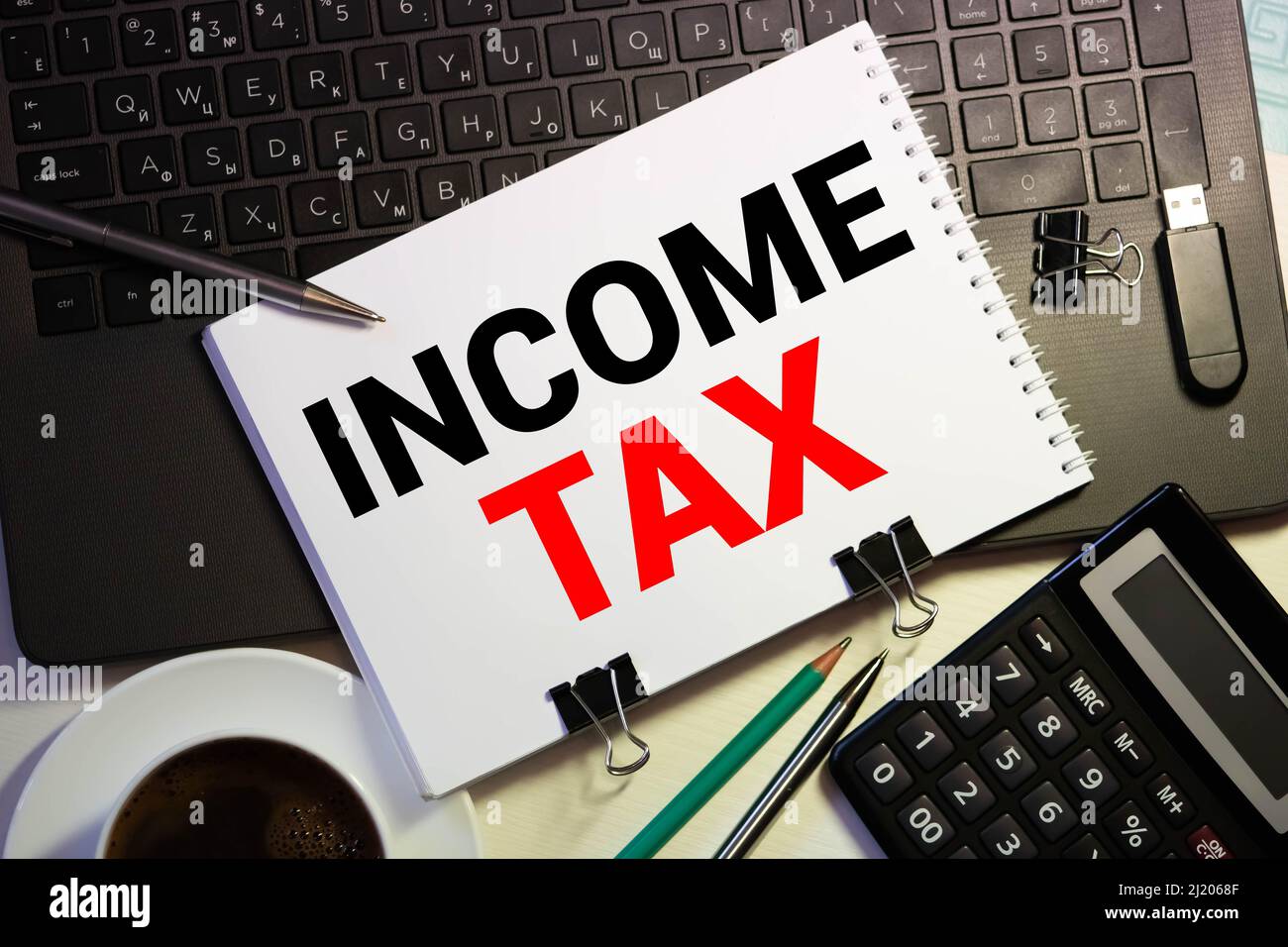 Income and Tax - blue binder on desk in the office Stock Photo - Alamy