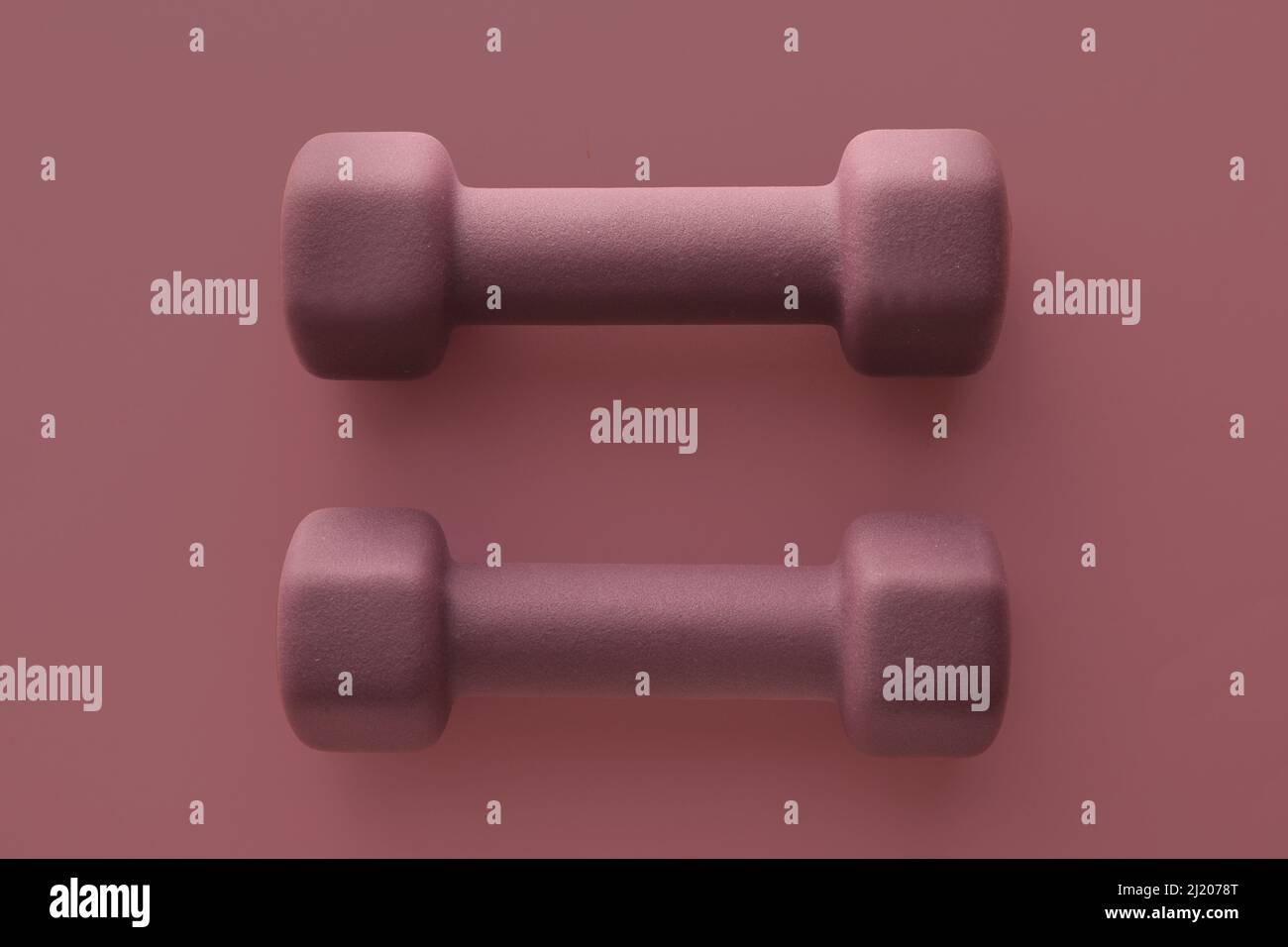 Pair of dumbbells on color background, top view Stock Photo - Alamy