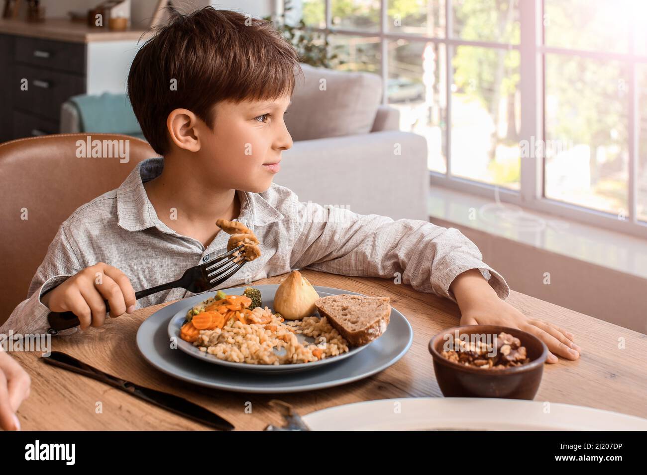 Muslim little boy having breakfast. Celebration of Eid al-Fitr Stock ...