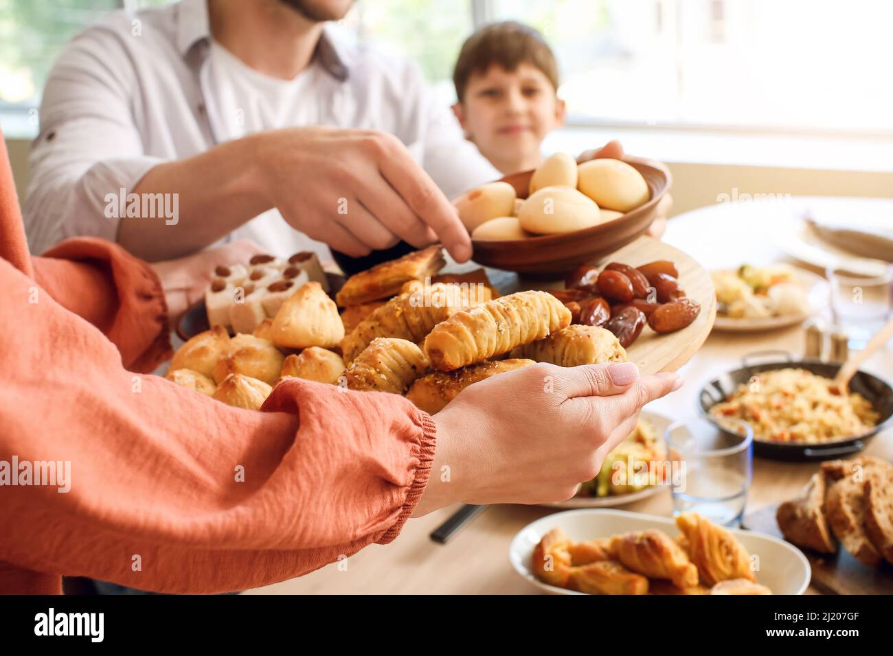 Muslim family having breakfast together. Celebration of Eid al-Fitr ...