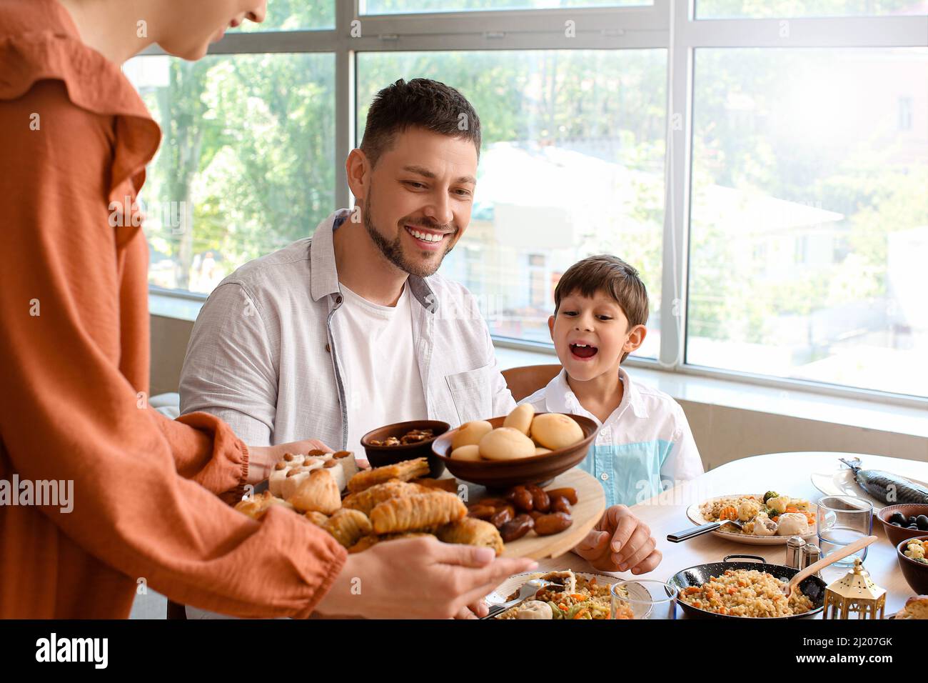 Child bringing dishes hi-res stock photography and images - Alamy
