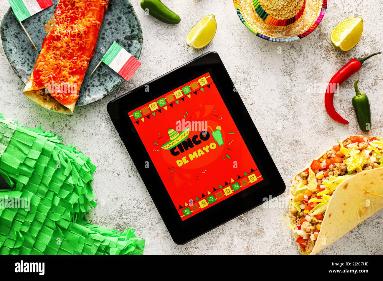 Traditional Mexican food and tablet computer on grunge background ...