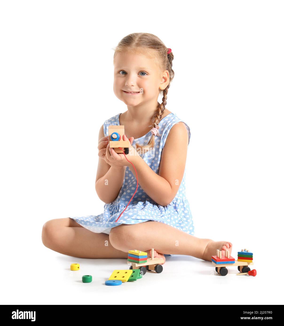 Cute little girl playing with building blocks on white background Stock ...