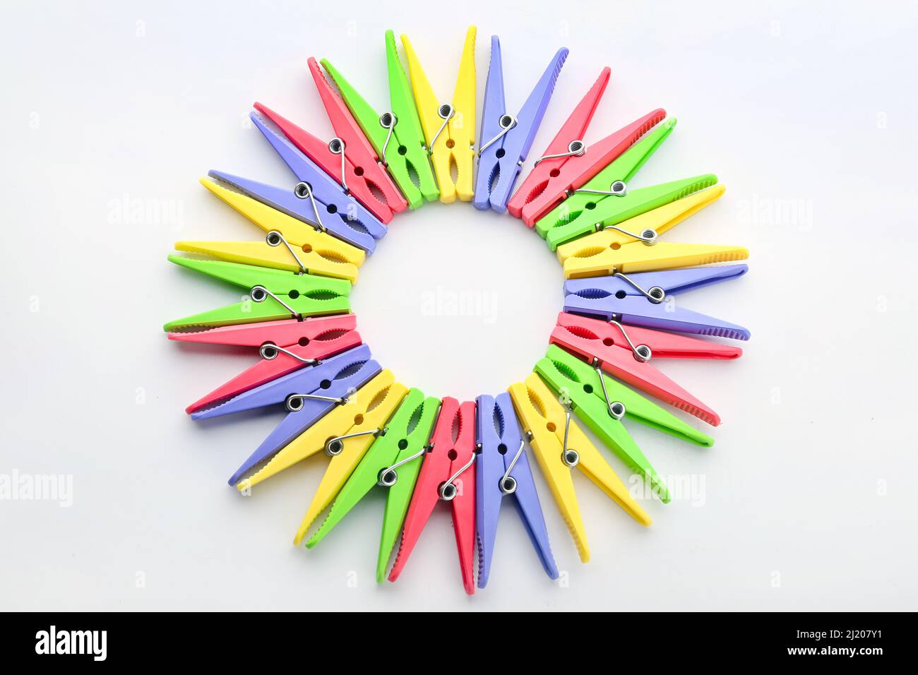 Frame made of plastic clothes pins on light background Stock Photo - Alamy