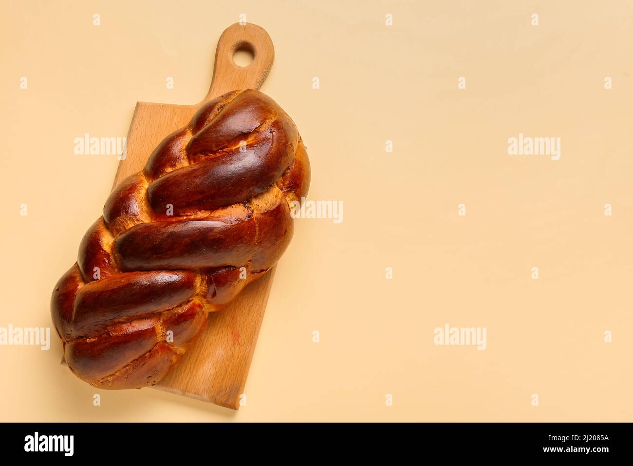 Traditional challah bread on light background. Shabbat Shalom Stock ...