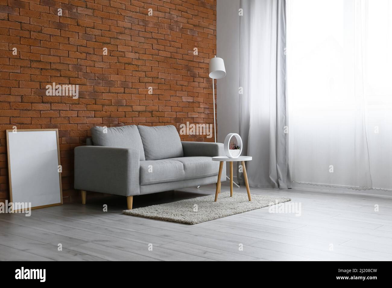 Interior of modern living room with stylish sofa and lamp Stock Photo ...
