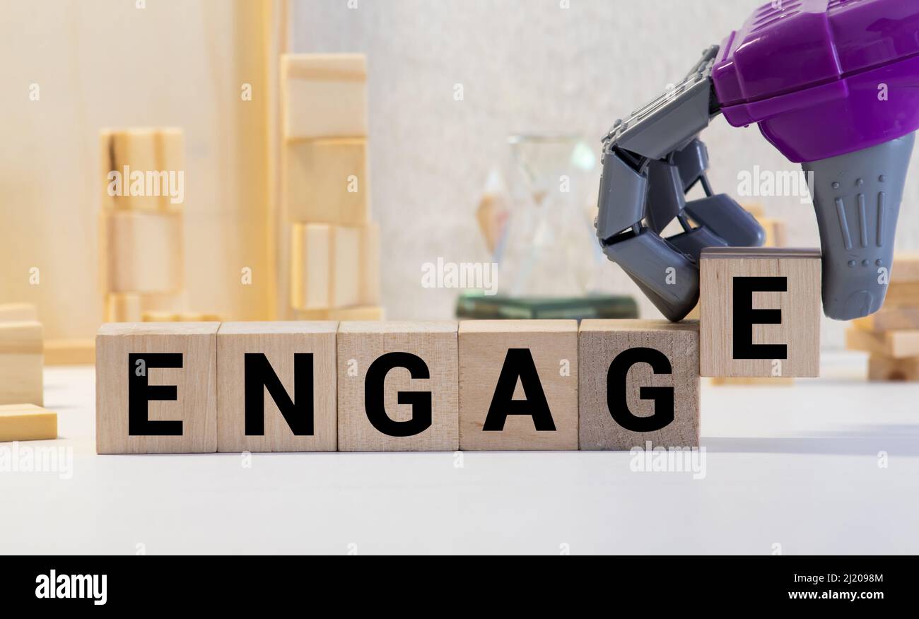 ENGAGE word made with building blocks, concept Stock Photo - Alamy