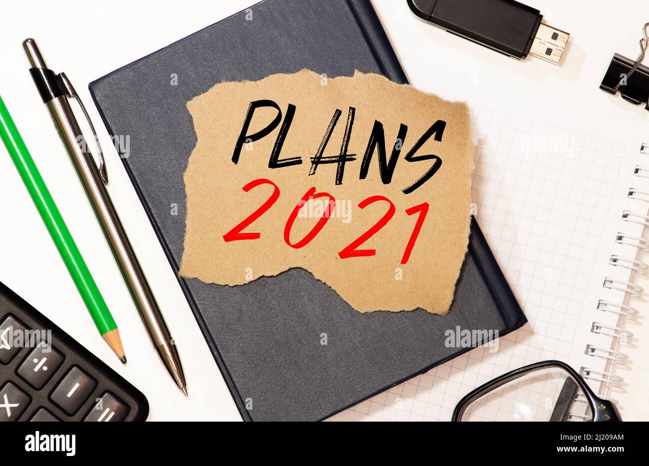 Plan 2021 words written in an office notebook. Concept in business ...