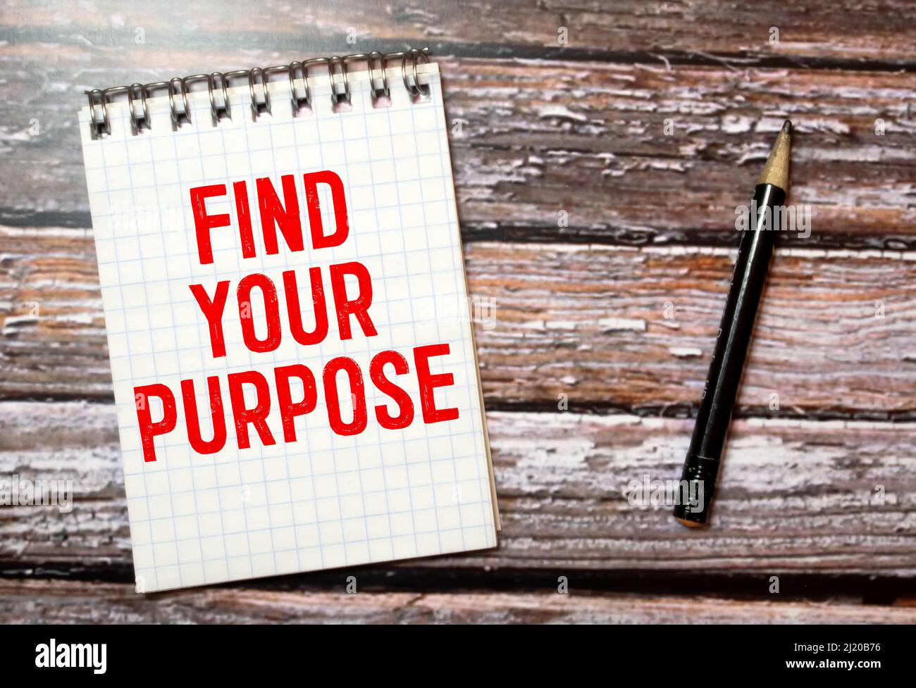 Find Your Purpose Text written on notebook page, red pencil on the ...