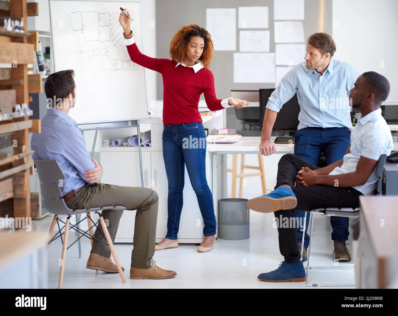 Getting their creativity revved up. Shot of a group of designers ...