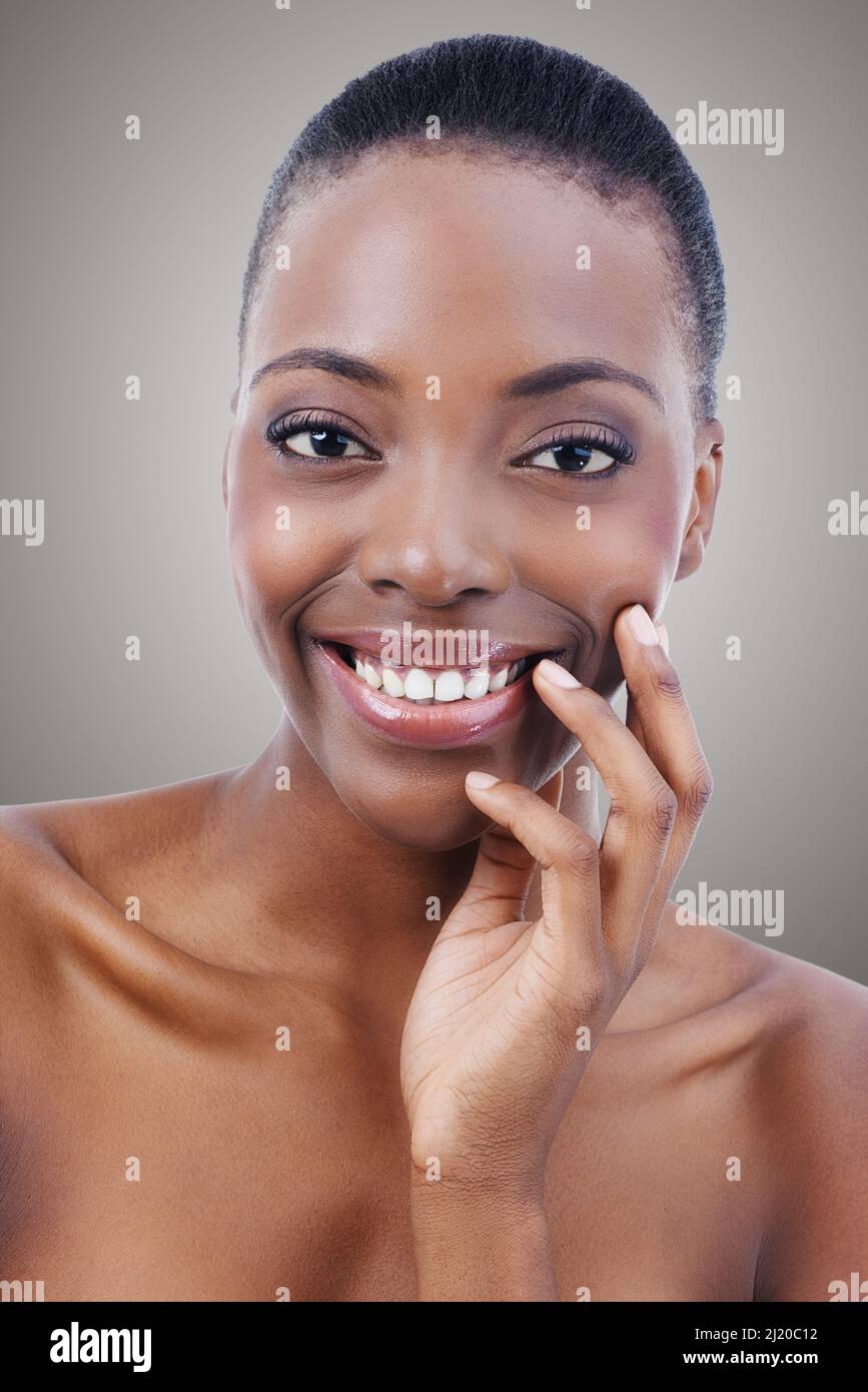 Beauty with a smile. Portrait of a beautiful african american woman ...