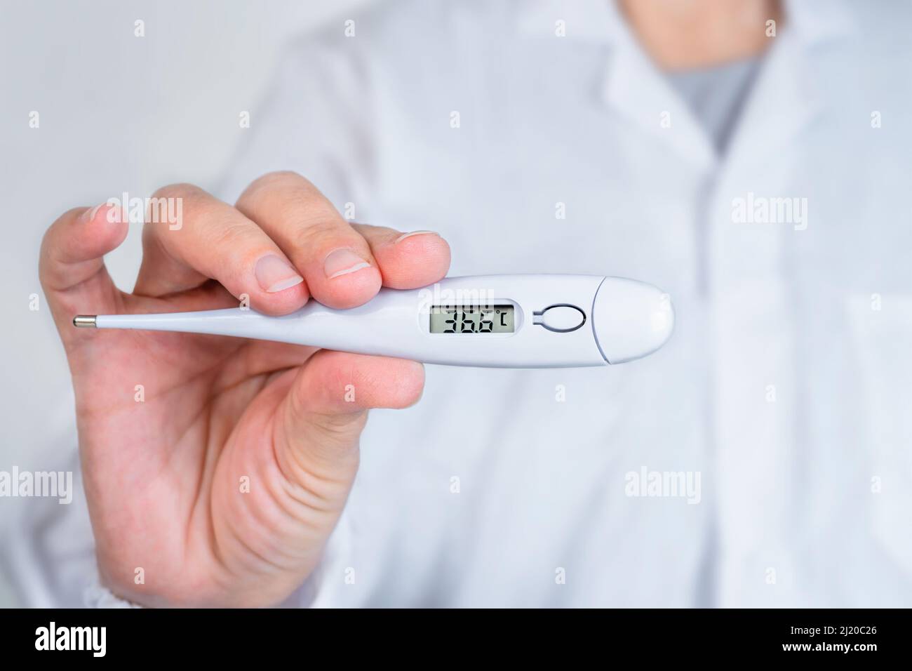 Doctor shows a thermometer with normal temperature close up Stock Photo ...