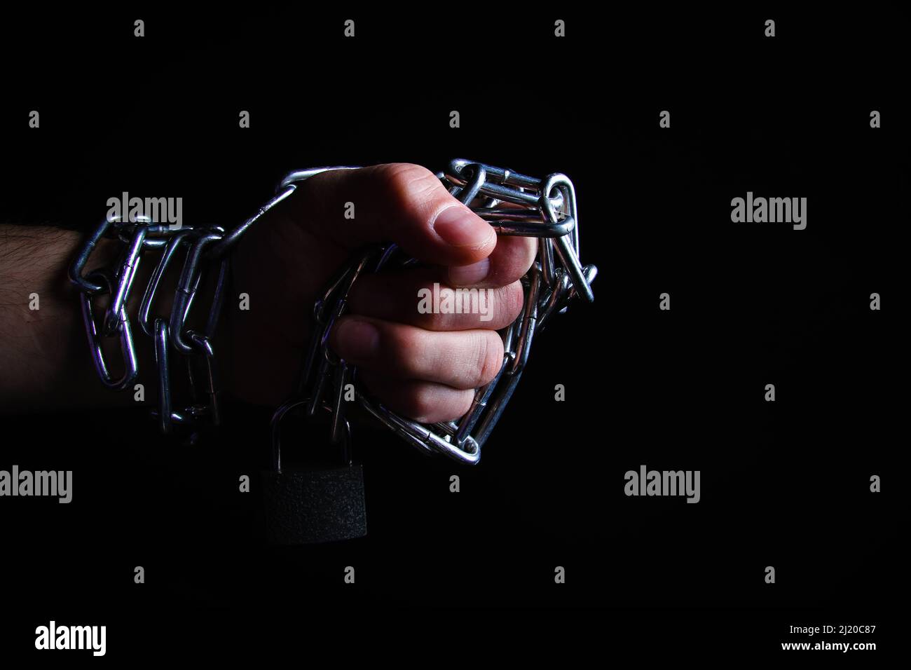 Chain and lock on hand. Arrest of a criminal. Handcuffs on the prisoner ...