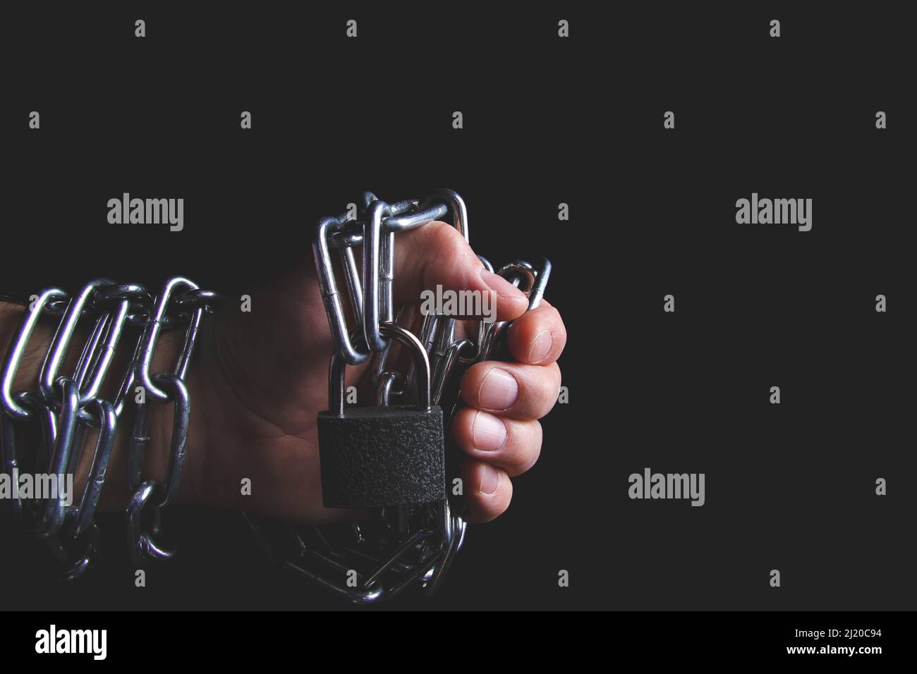 Chain and lock on hand. Arrest of a criminal. Handcuffs on the prisoner ...