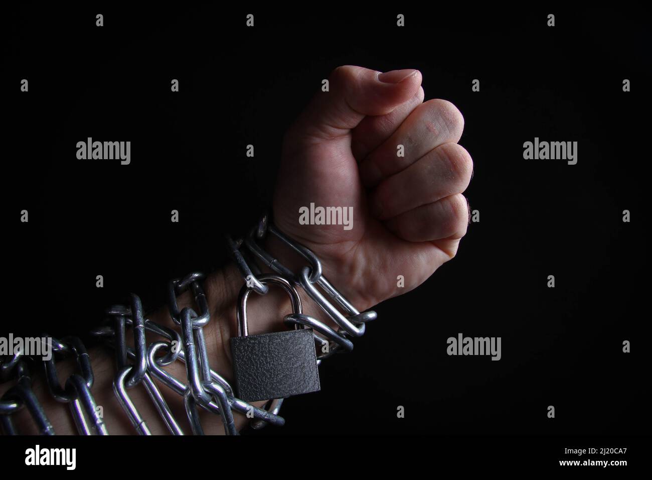 Chain and lock on hand. Arrest of a criminal. Handcuffs on the prisoner ...