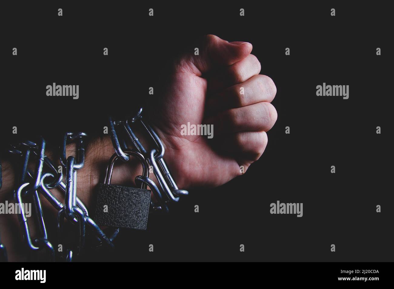 Chain and lock on hand. Arrest of a criminal. Handcuffs on the prisoner ...