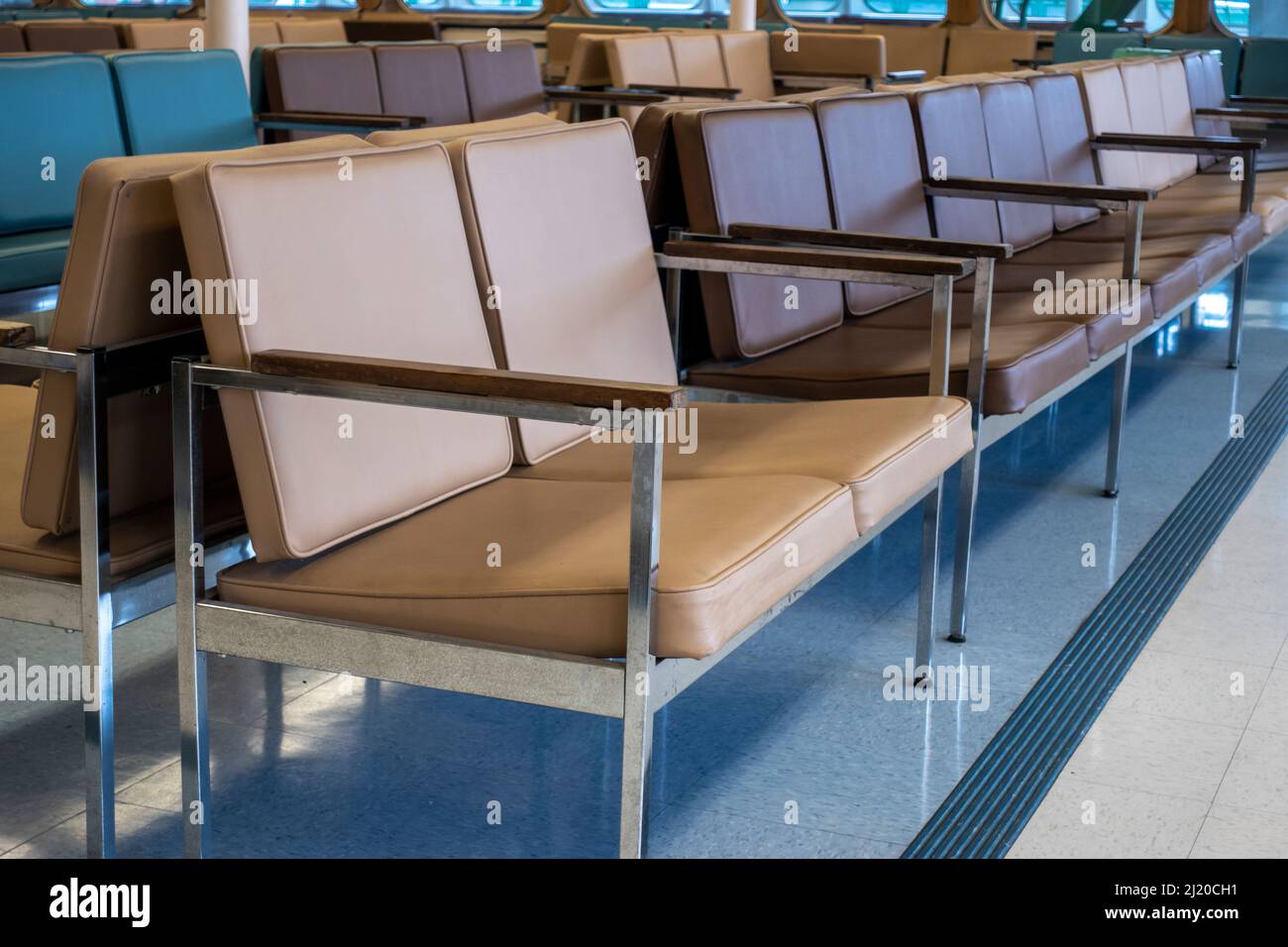 Angled view of padded bench seating inside of a Washington State Ferry ...