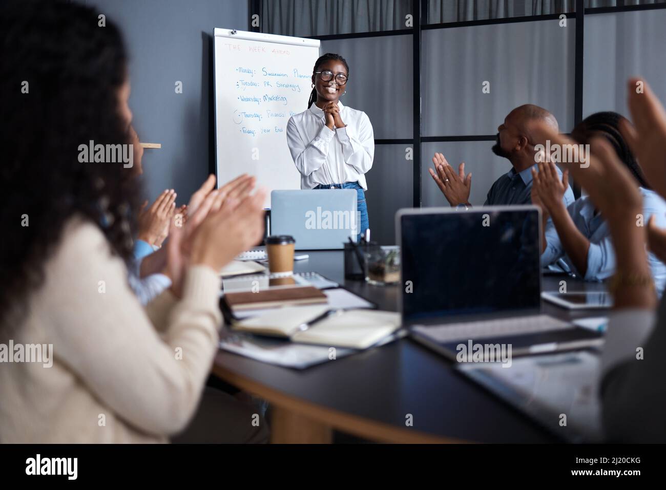 She should be impressed with herself. Shot of a group of businesspeople ...