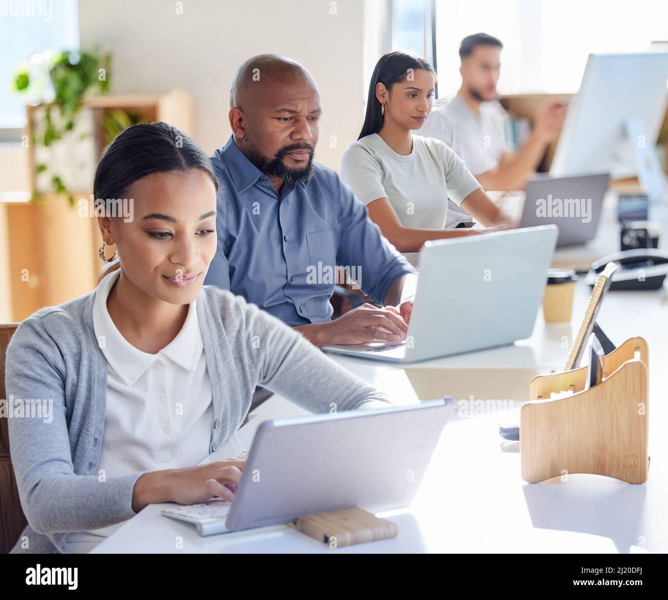 Group working on laptops hi-res stock photography and images - Alamy