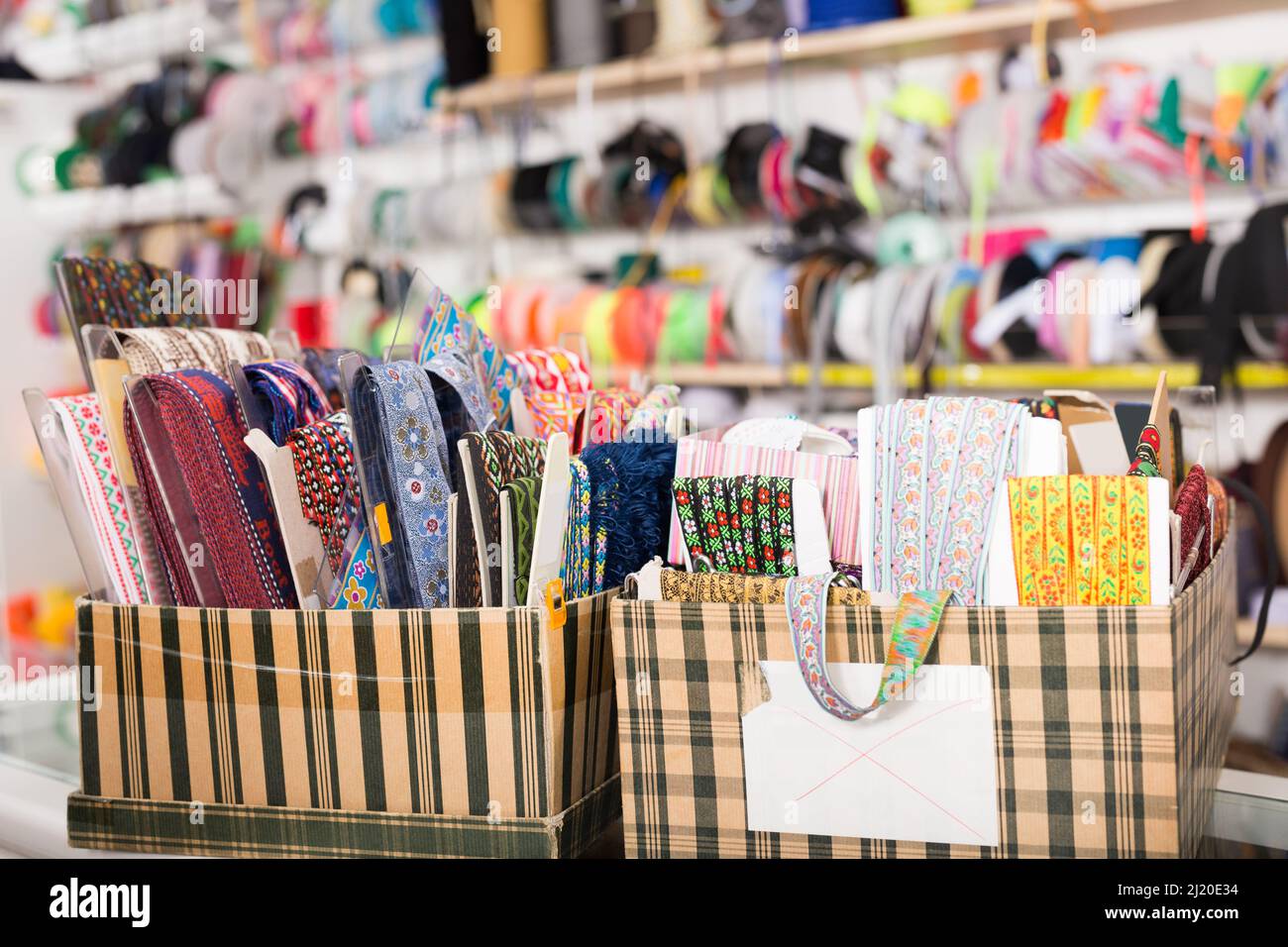 Colorful ribbons on counter in store Stock Photo - Alamy