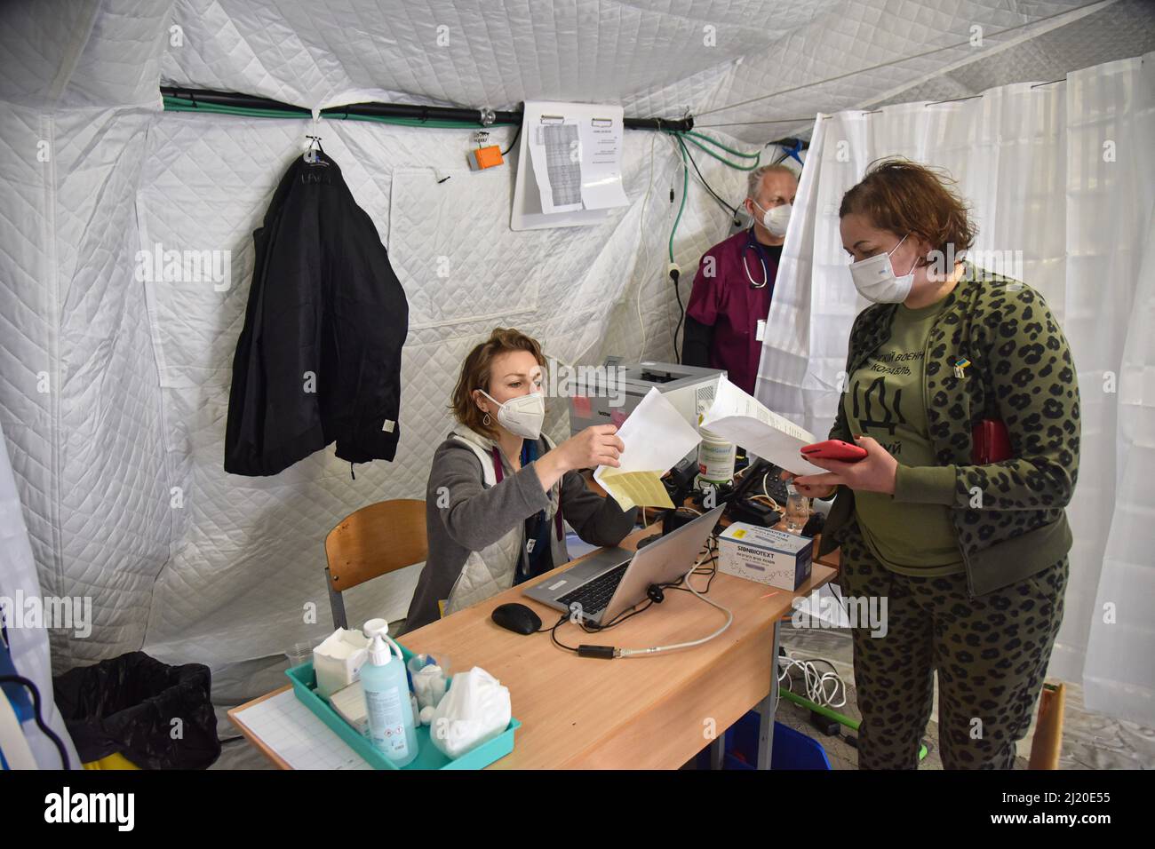 Mostyska, Ukraine. 26th Mar, 2022. A doctor gives the results of tests ...